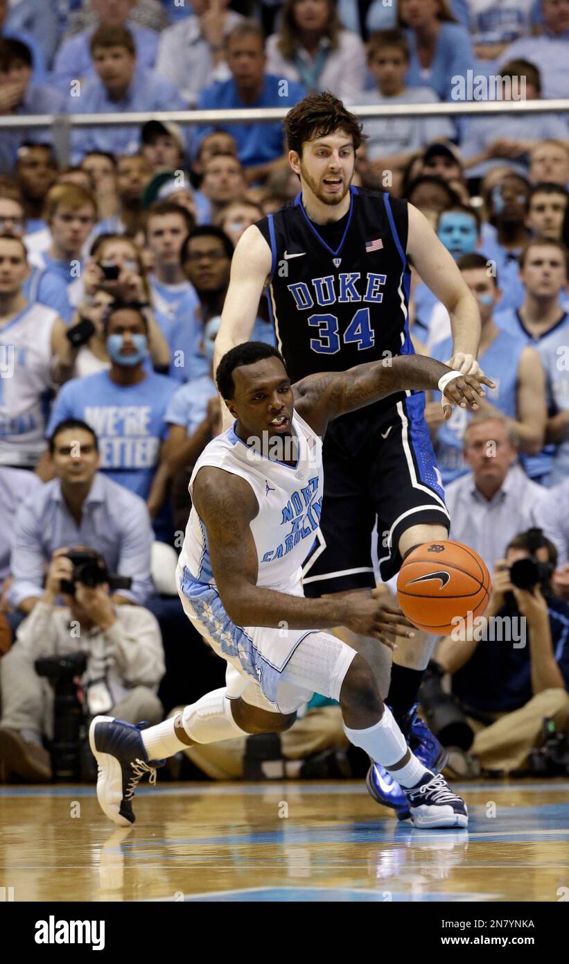 North Carolina's P.J. Hairston dribbles as Duke's Ryan Kelly (34 ...