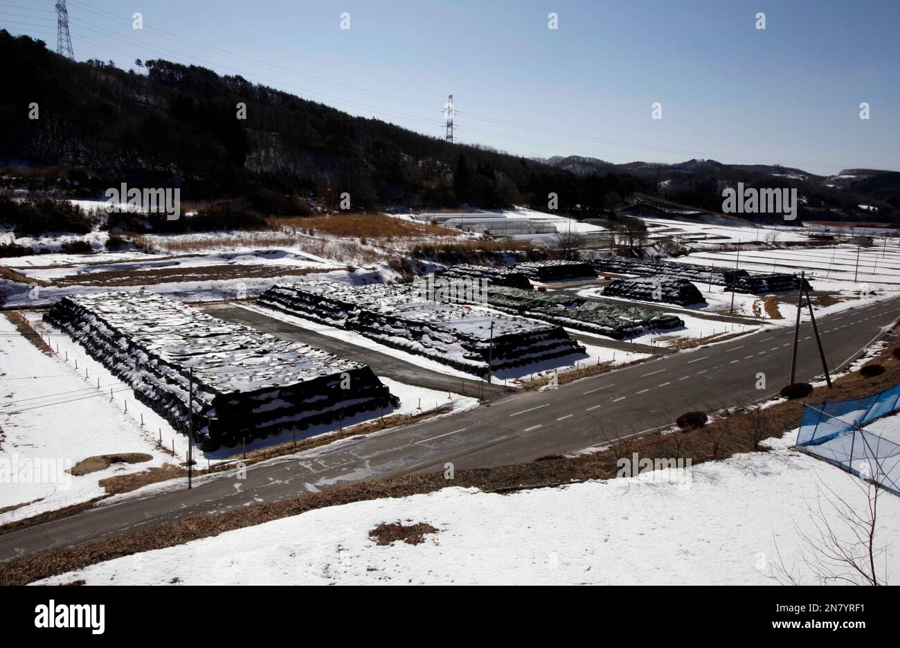 In this Monday, March 4, 2013 photo, piles of radiation-contaminated ...