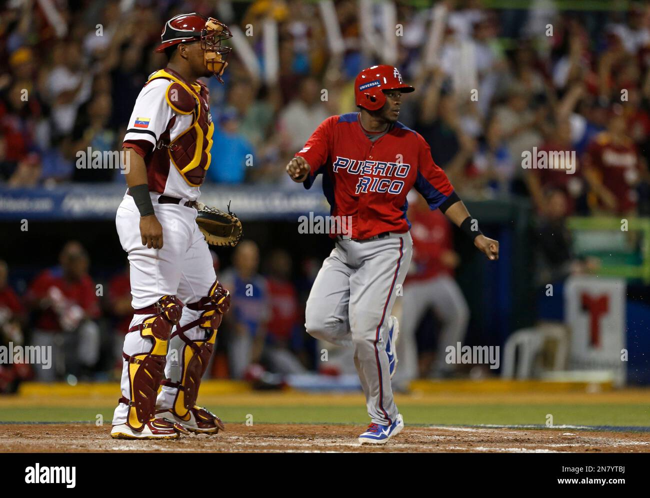 Puerto Rico's Irving Falu, right, scores on a double off teammate Mike ...