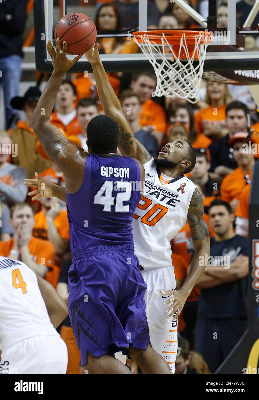 Oklahoma State forward Michael Cobbins (20) blocks a shot by Kansas ...