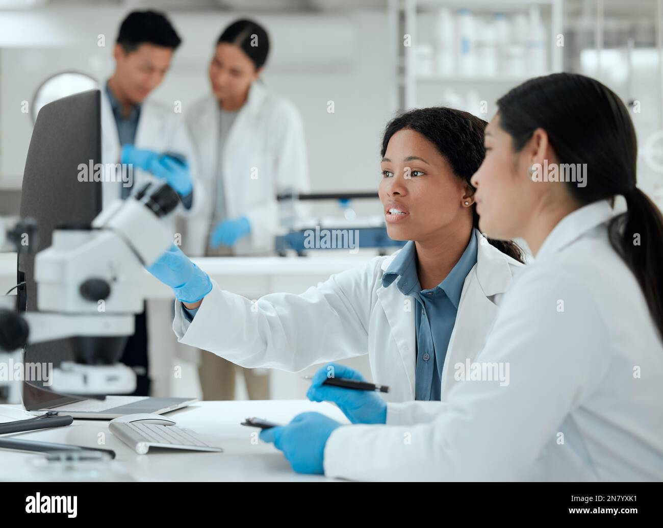 I think I may be close. two scientists helping one another in the lab ...