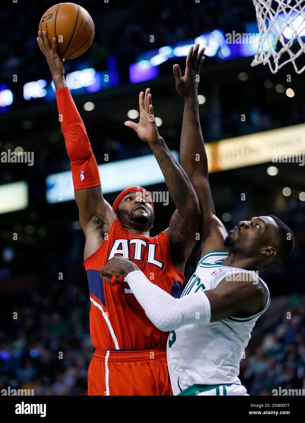 Atlanta Hawks' Josh Smith, left, shoots against Boston Celtics' Jeff ...