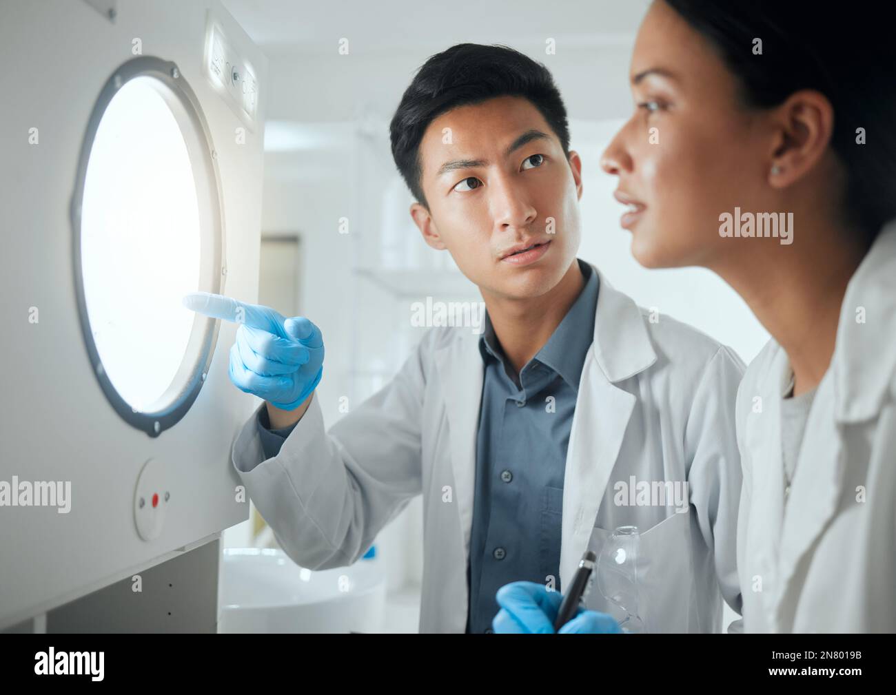 Asian male female scientists work hi-res stock photography and images ...
