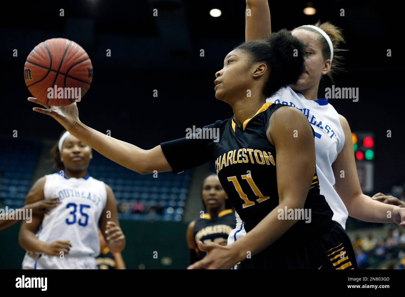 Charleston's Jayla Bullock (11) reaches for her blocked shot by ...