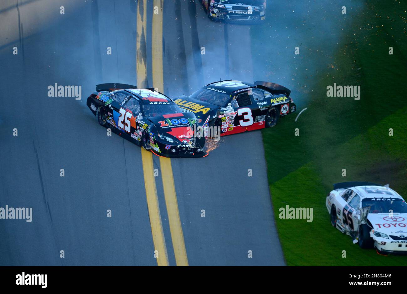 Justin Boston (25) and Drew Charlson (3) slide along the apron of the ...