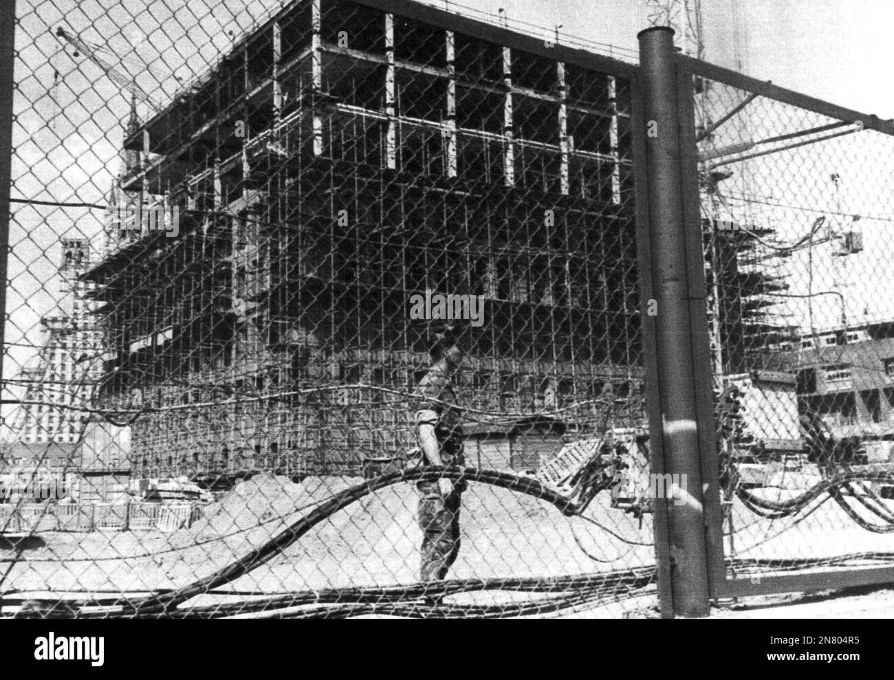 A. U.S. Marine stands guard inside the high fence surrounding the ...