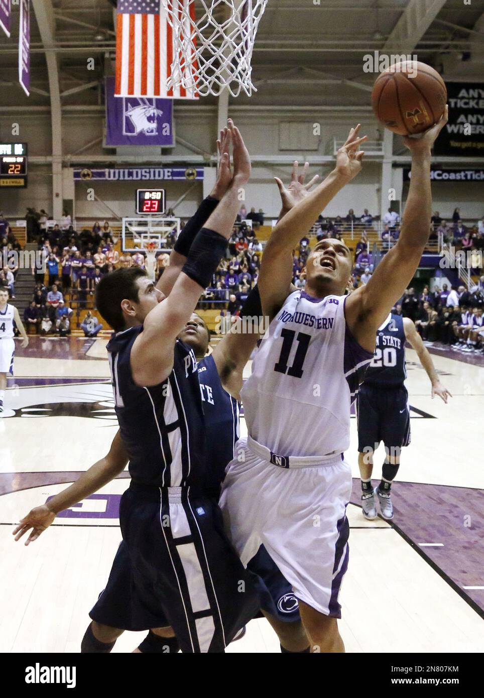 Northwestern guard Reggie Hearn (11) shoots and scores past Penn State ...