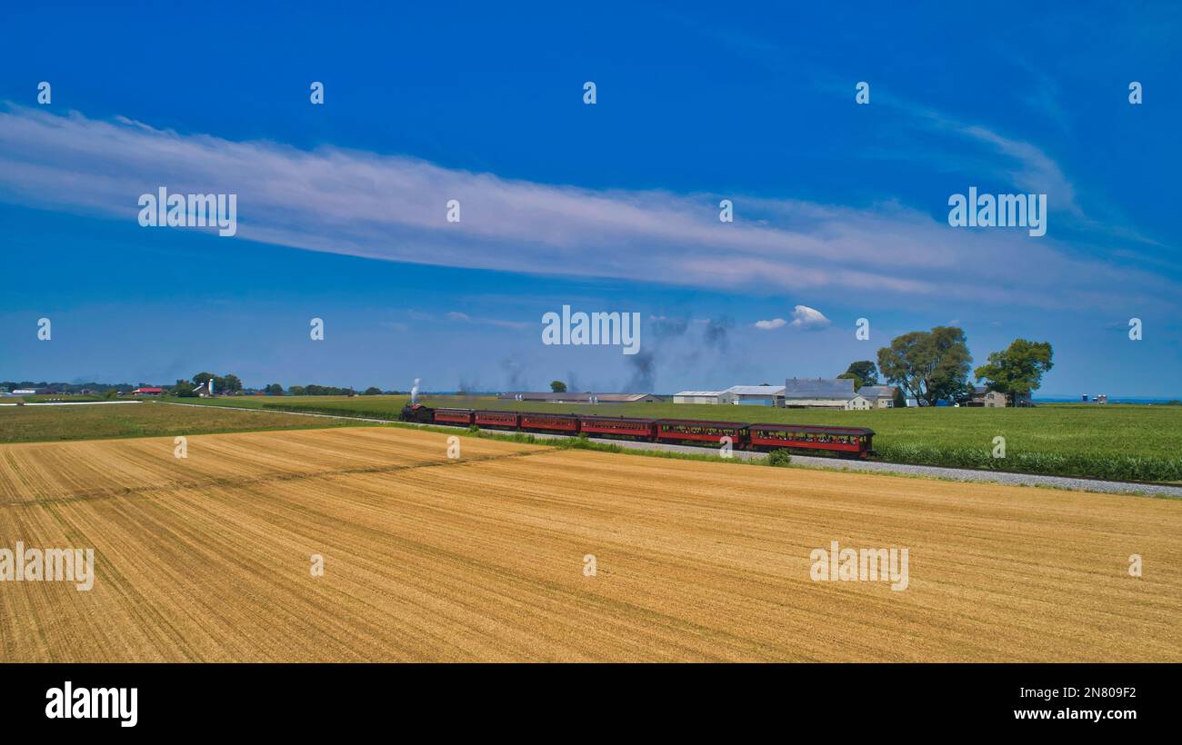 Aerial View of a Steam Passenger Train Approaching, Traveling Through ...