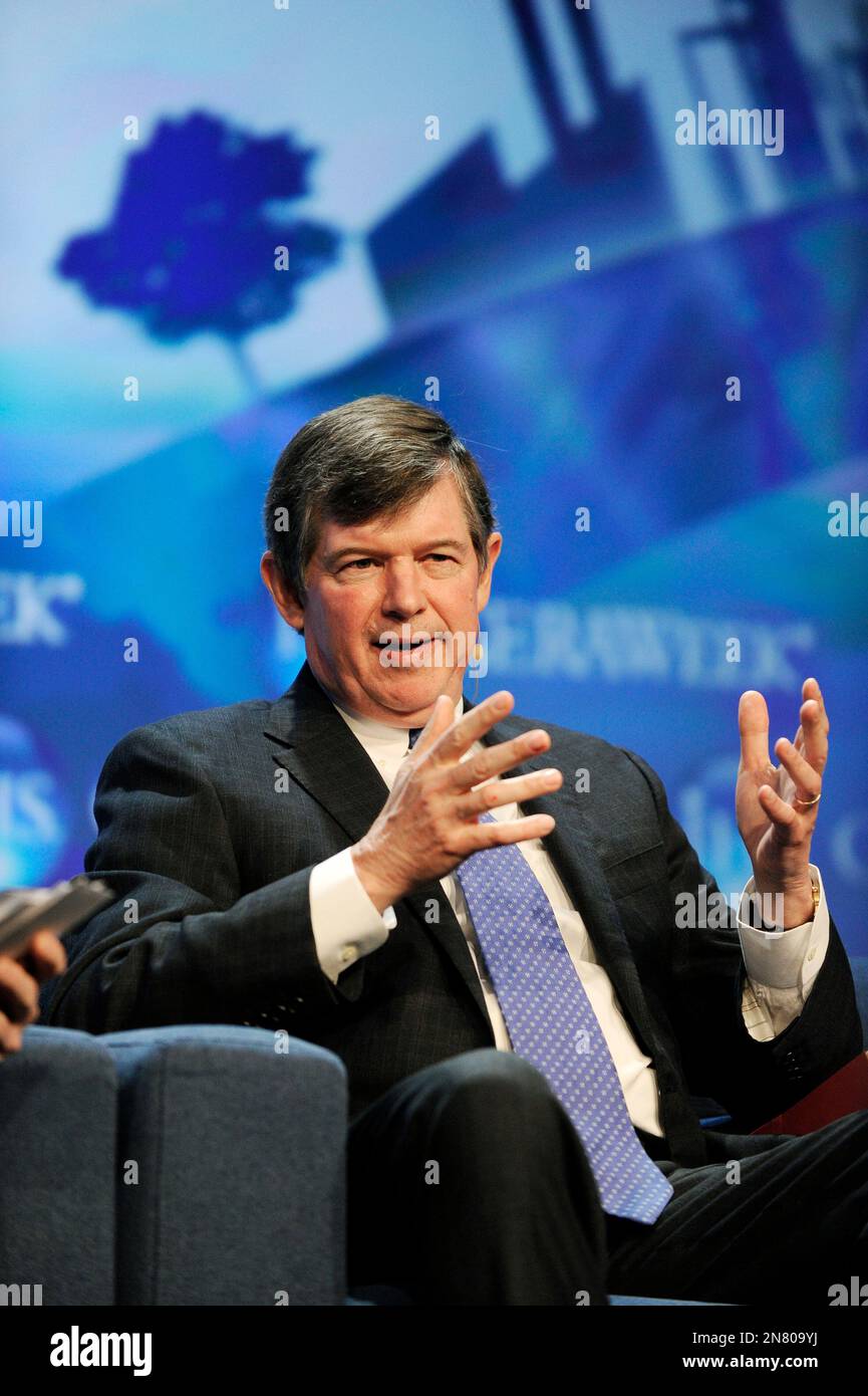 PG&E Corp. chairman, CEO and president Anthony Earley laughs during a ...
