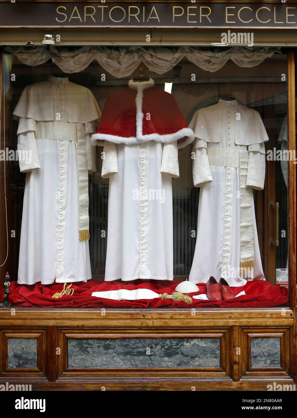 FILE - In this March 4, 2013 file photo, three sets of papal outfits ...
