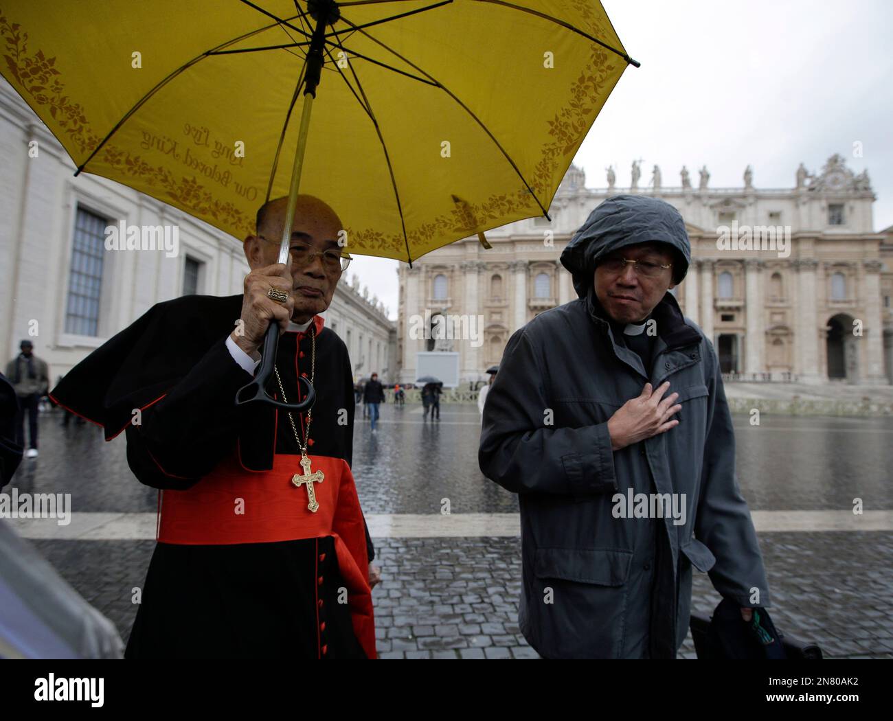 Cardinal Michael Michai Kitbunchu, of Thailand, left, walks in St ...