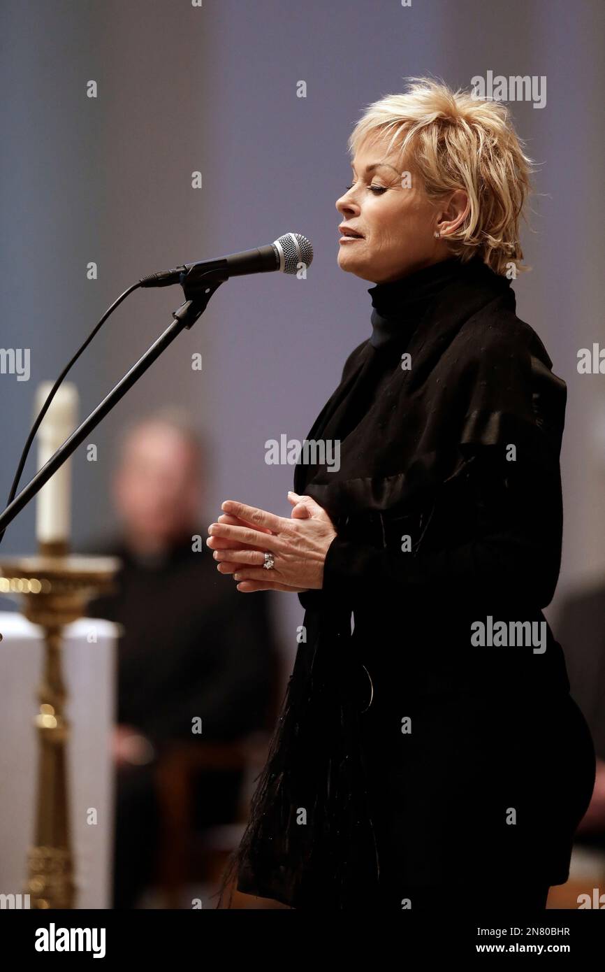 Lorrie Morgan sings "Ave Maria" during a memorial service for country ...