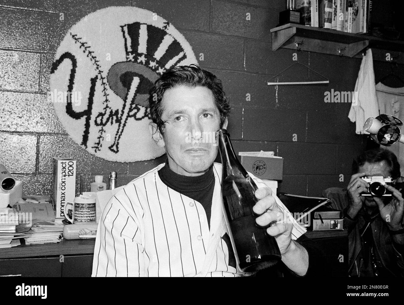 Yankees manager Billy Martin drinks from a champagne bottle after the ...