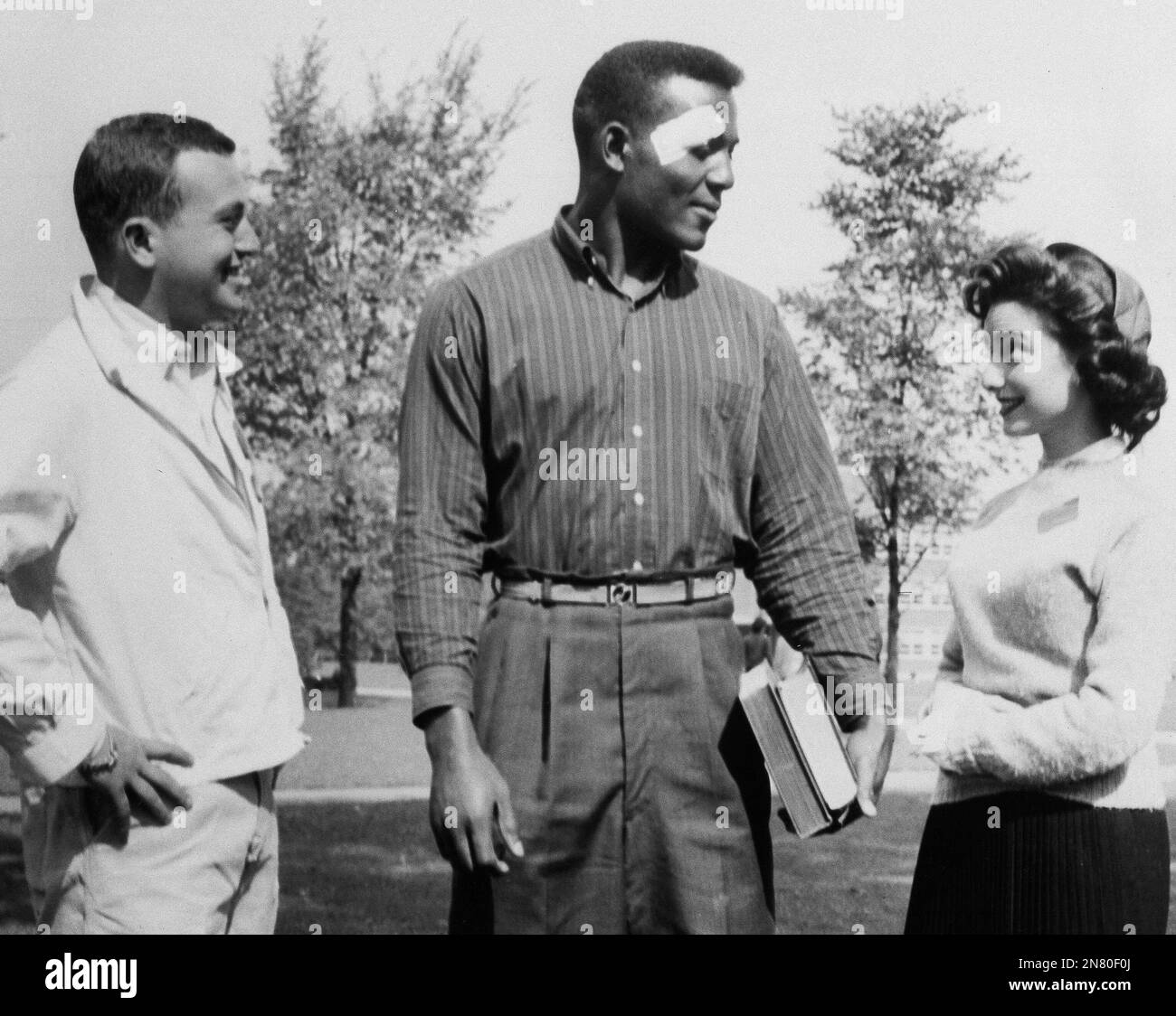 Syracuse University football star Jim Brown, center, talks with fellow ...