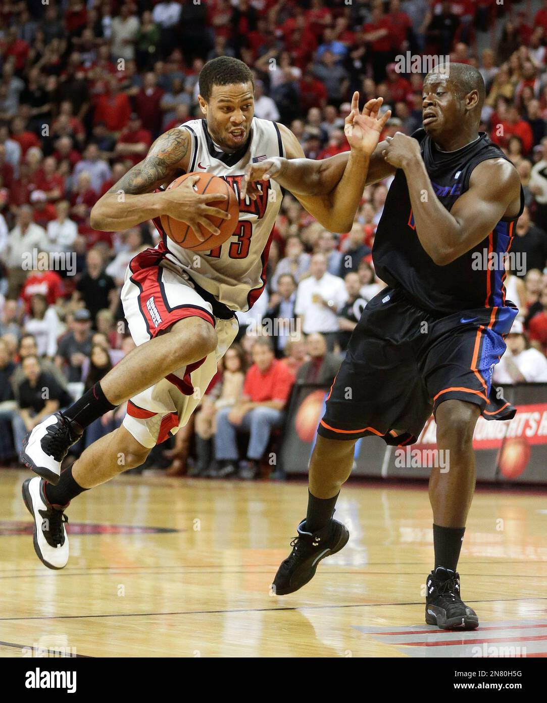 UNLV's Bryce Dejean-Jones, left, drives through the lane against Boise ...