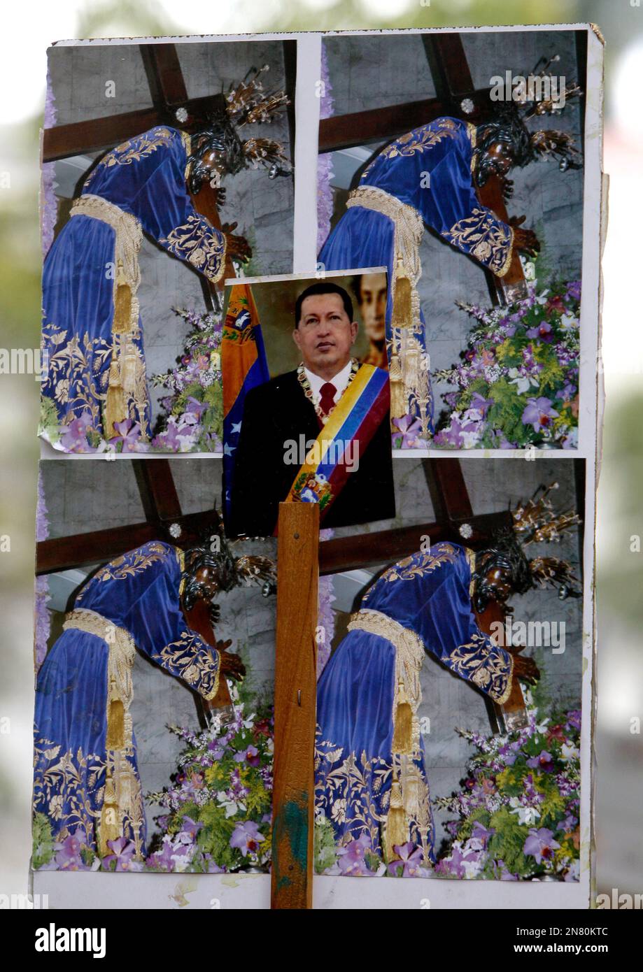 A poster showing a photo of Venezuela's President Hugo Chavez with ...