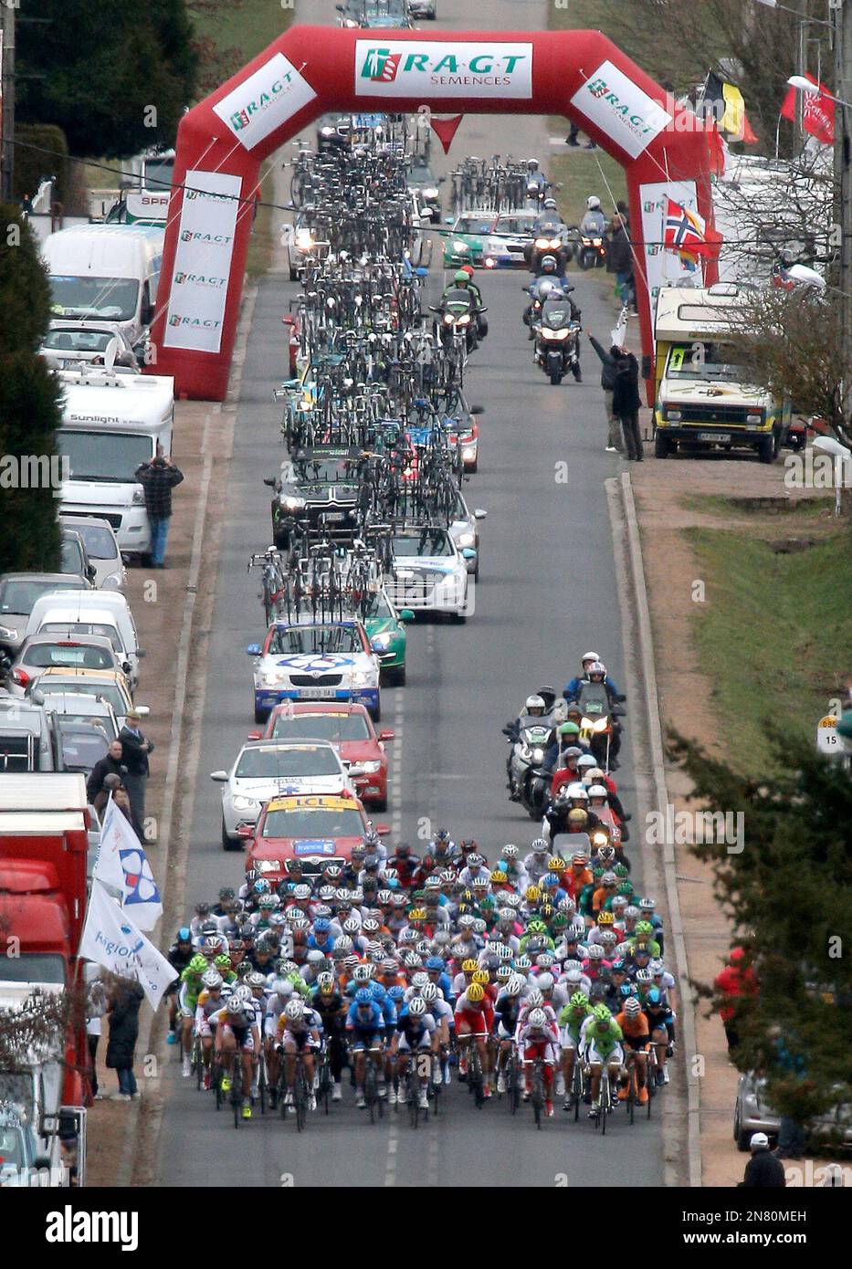 The pack of cyclists rides during the second leg of the Paris-Nice ...
