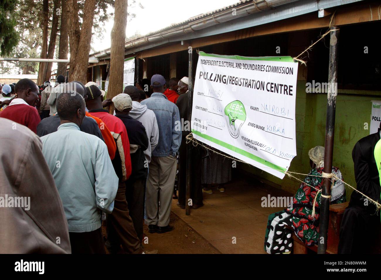 Kenyan voters line up to cast their votes in the Kibera slum, Nairobi ...