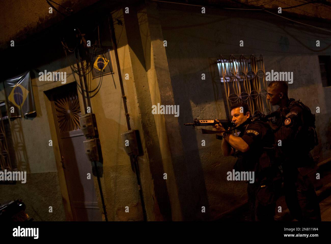 Police officers patrol the Parque Alegria slum during a conjoint ...