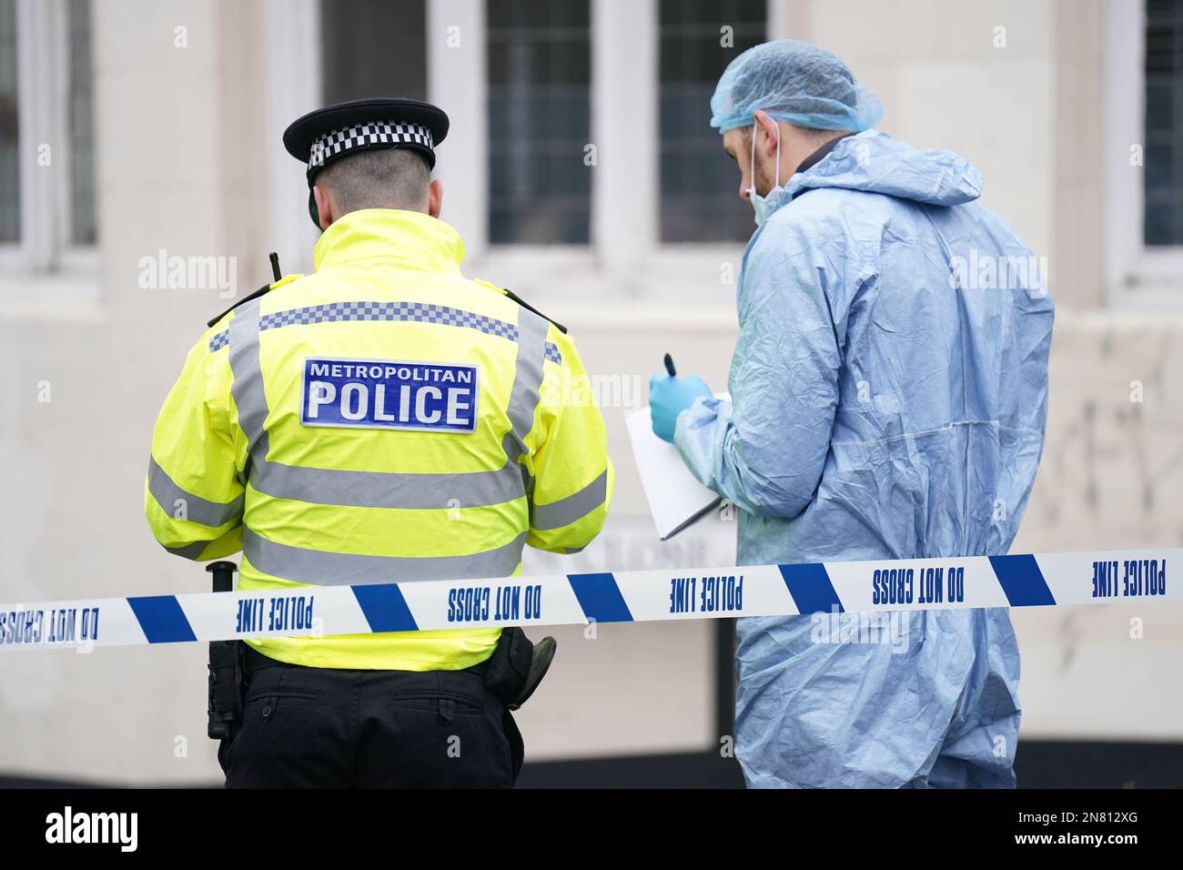 A police officer with a forensics officer at the scene at White Post ...