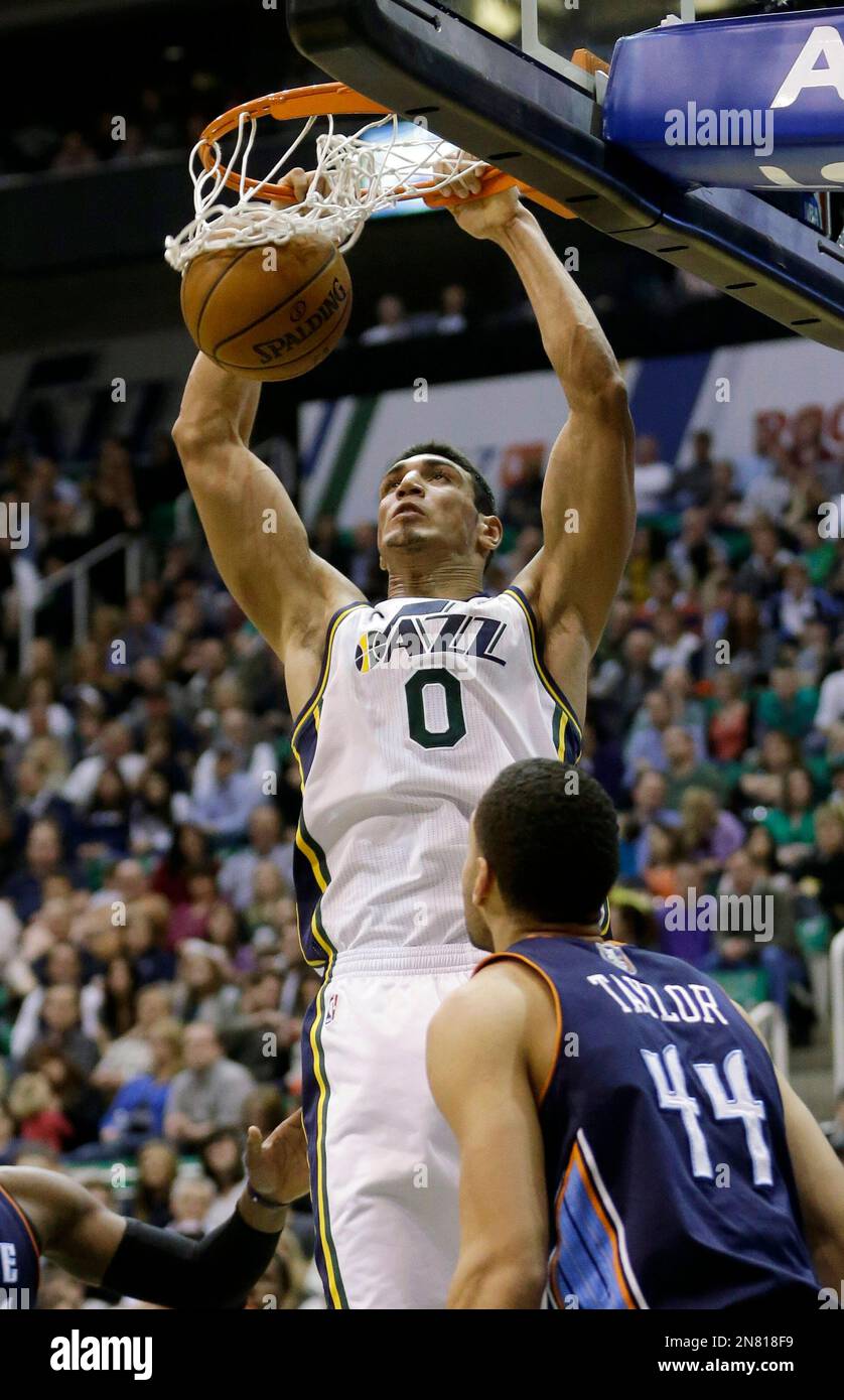 Utah Jazz's Enes Kanter (0) dunks the ball as Charlotte Bobcats ...