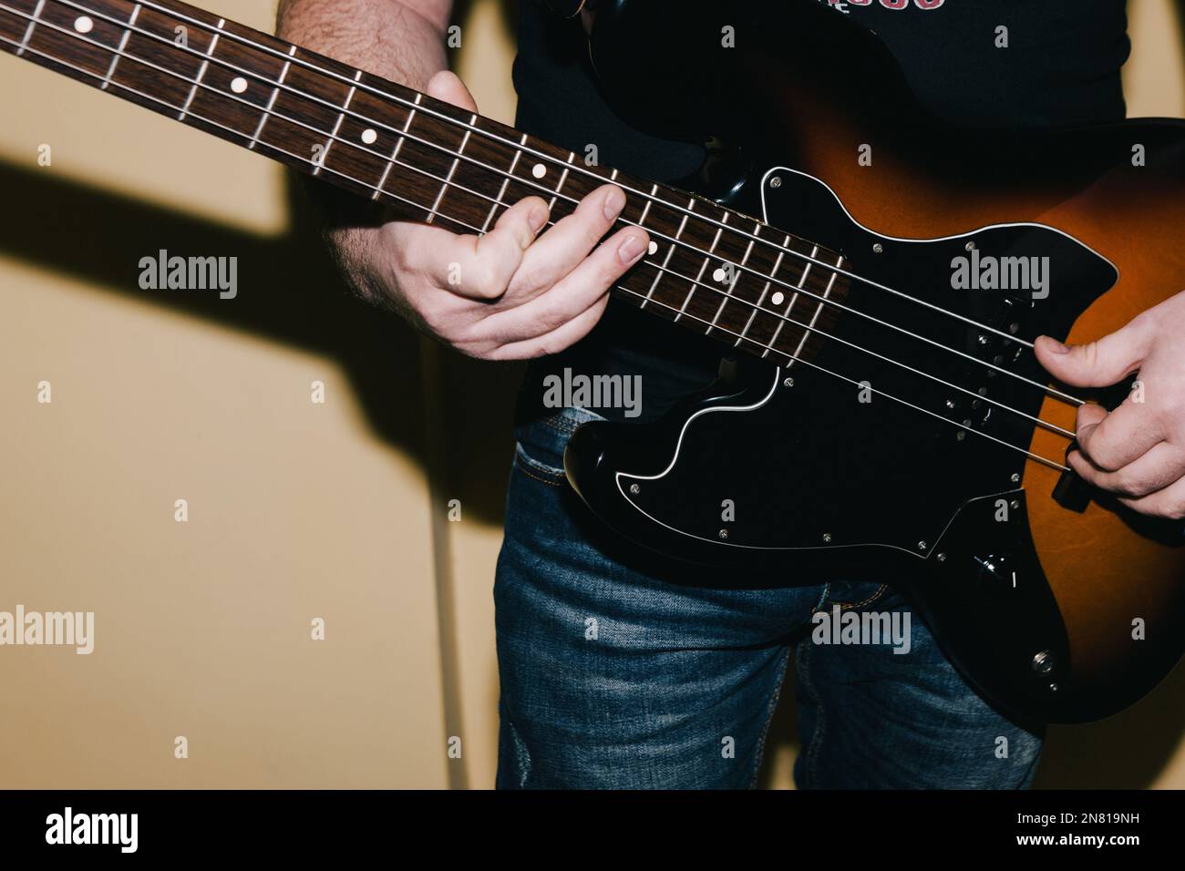 Bass guitar strings closeup. Music background Stock Photo - Alamy