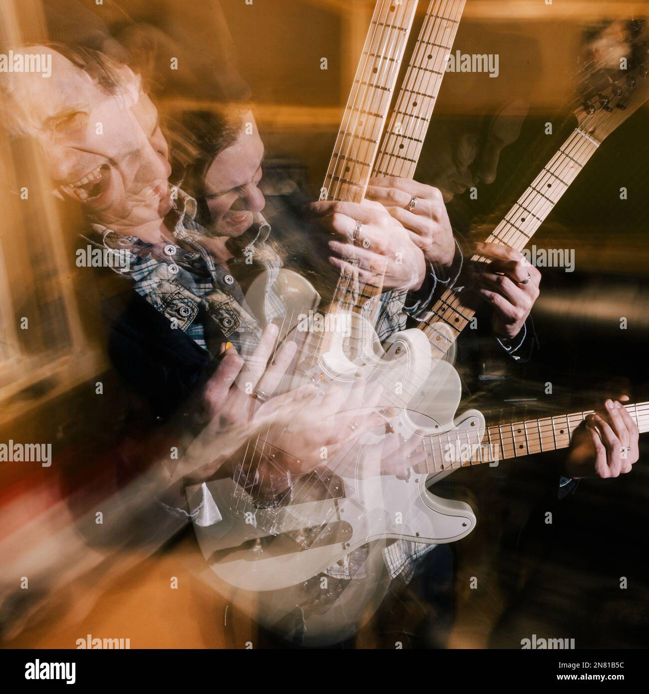 Aggressive guitarist portrait in double exposure Stock Photo - Alamy