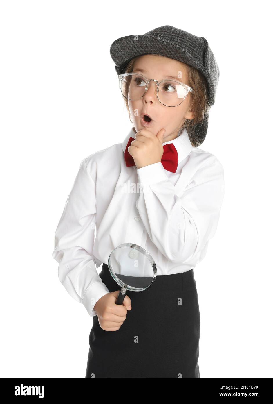 Cute little child in hat with magnifying glass playing detective on ...