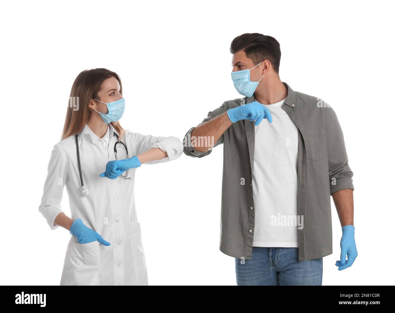 Doctor and patient doing elbow bump instead of handshake on white ...