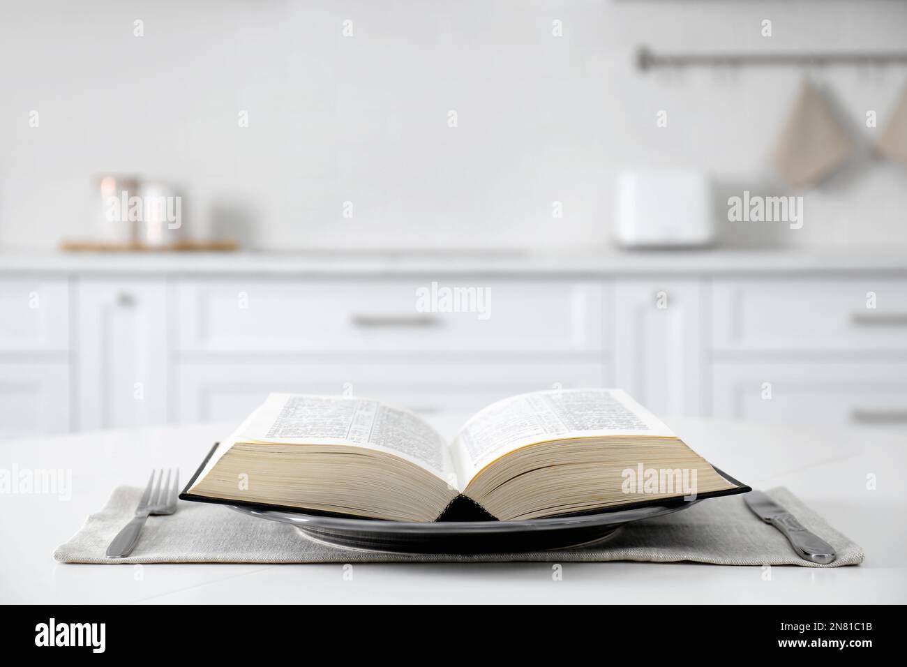 Table setting with Holy Bible on white background. Great Lent season ...
