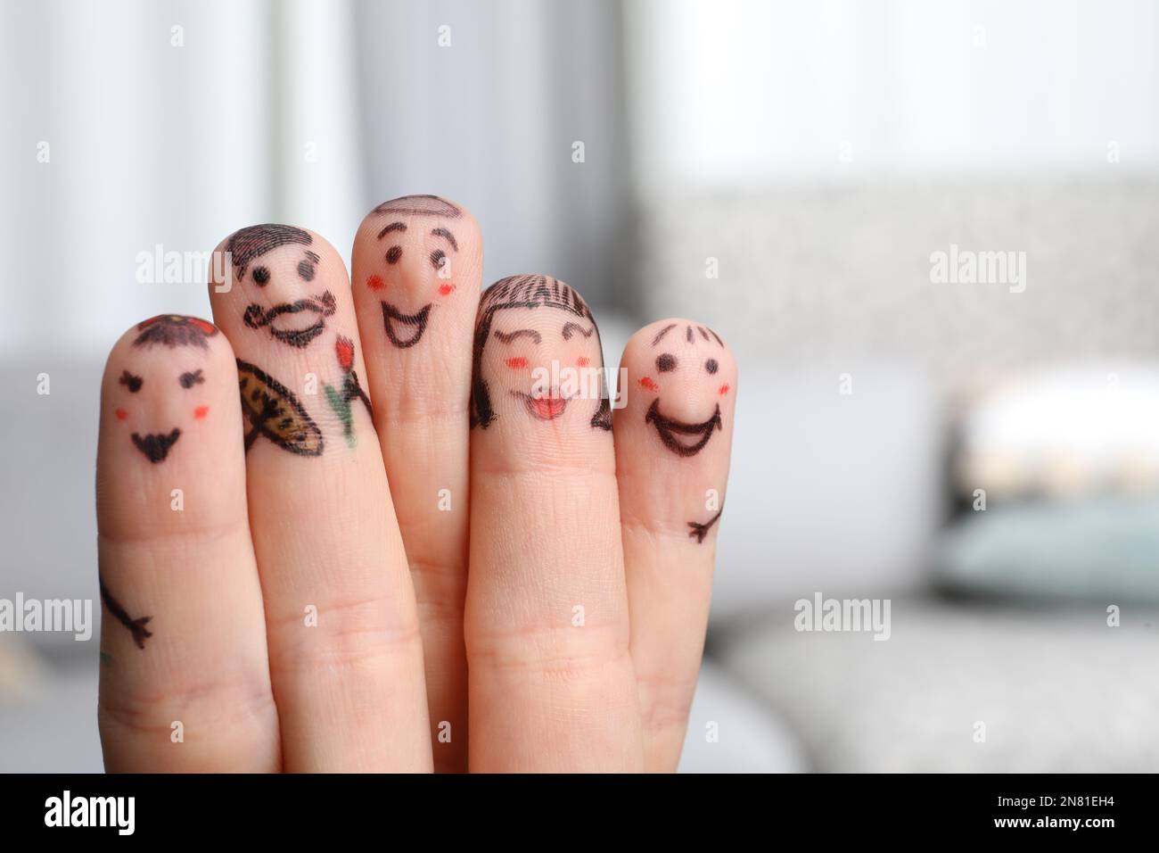 Five fingers with drawings of happy faces on blurred background Stock ...