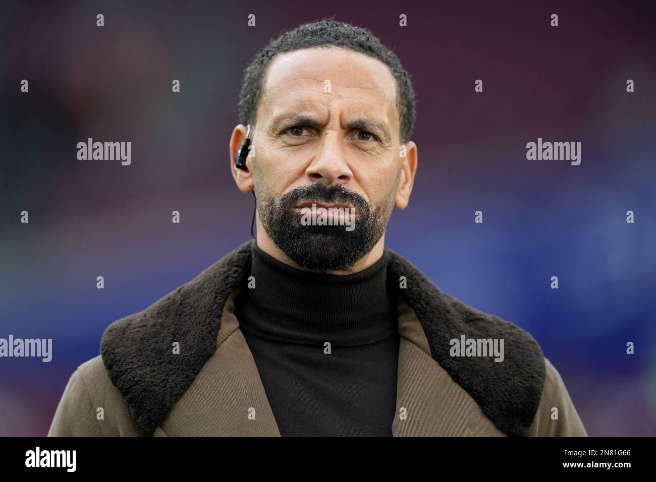 Former footballer, Rio Ferdinand, looks on while carrying out TV duties ...