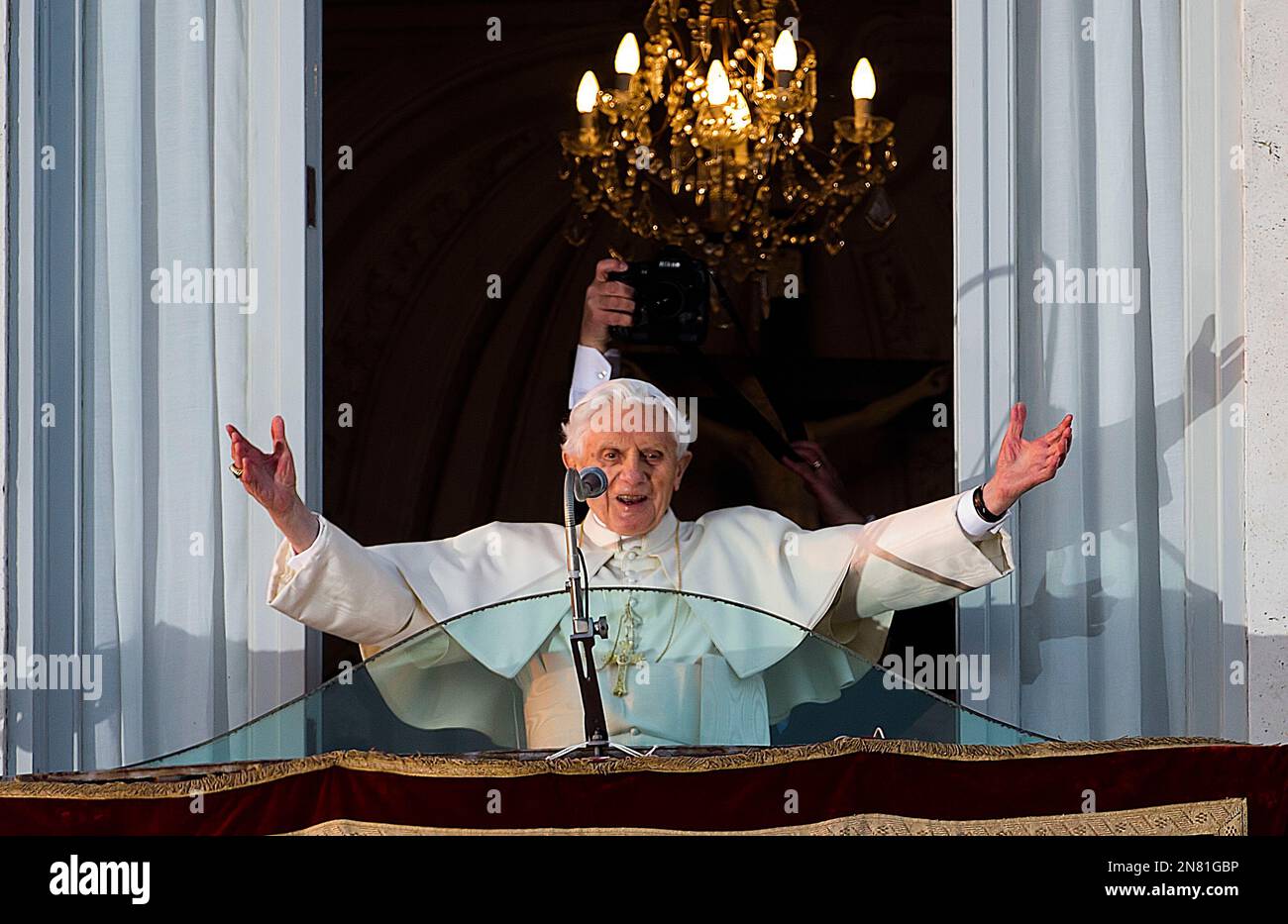 Pope Benedict XVI salutes a cheering crowd gathered to see him from the ...