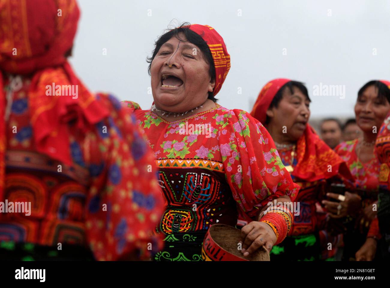 In this Feb. 25, 2013 photo, women sing and dance during anniversary ...