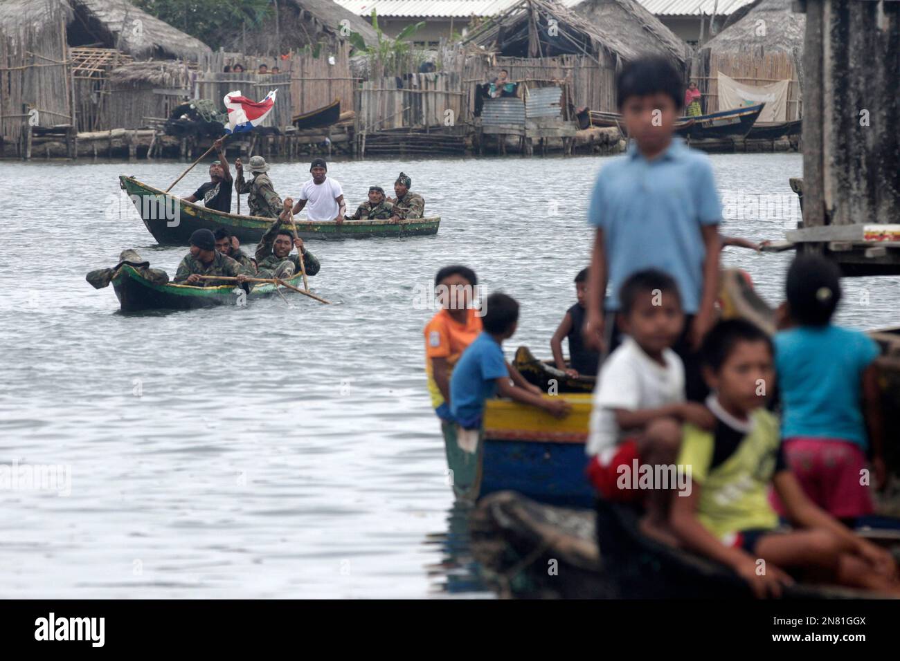 In this Feb. 25, 2013 photo, men in a boat, left, represent Panamanian ...