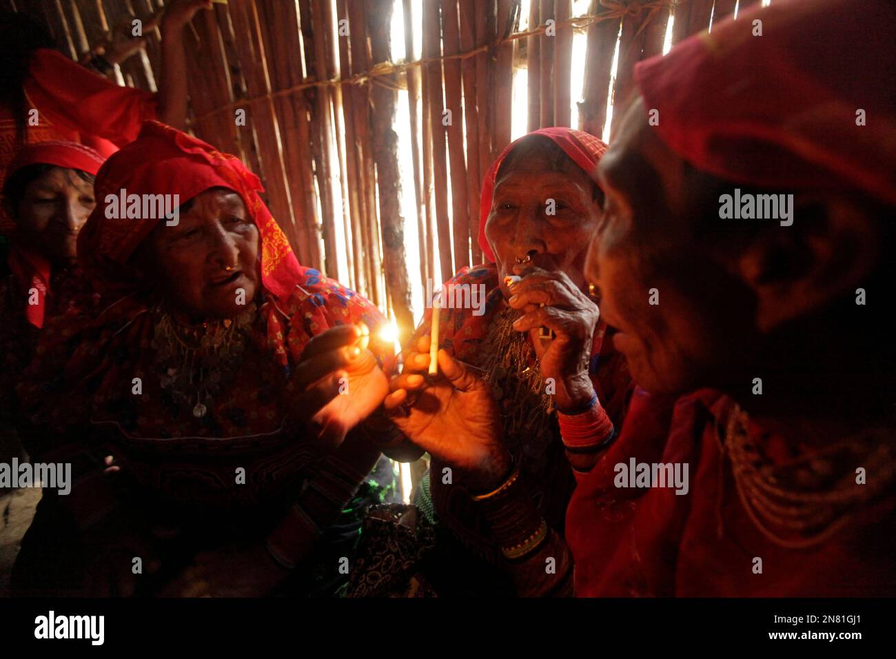 In this Feb. 25, 2013 photo, women smoke cigarettes during anniversary ...