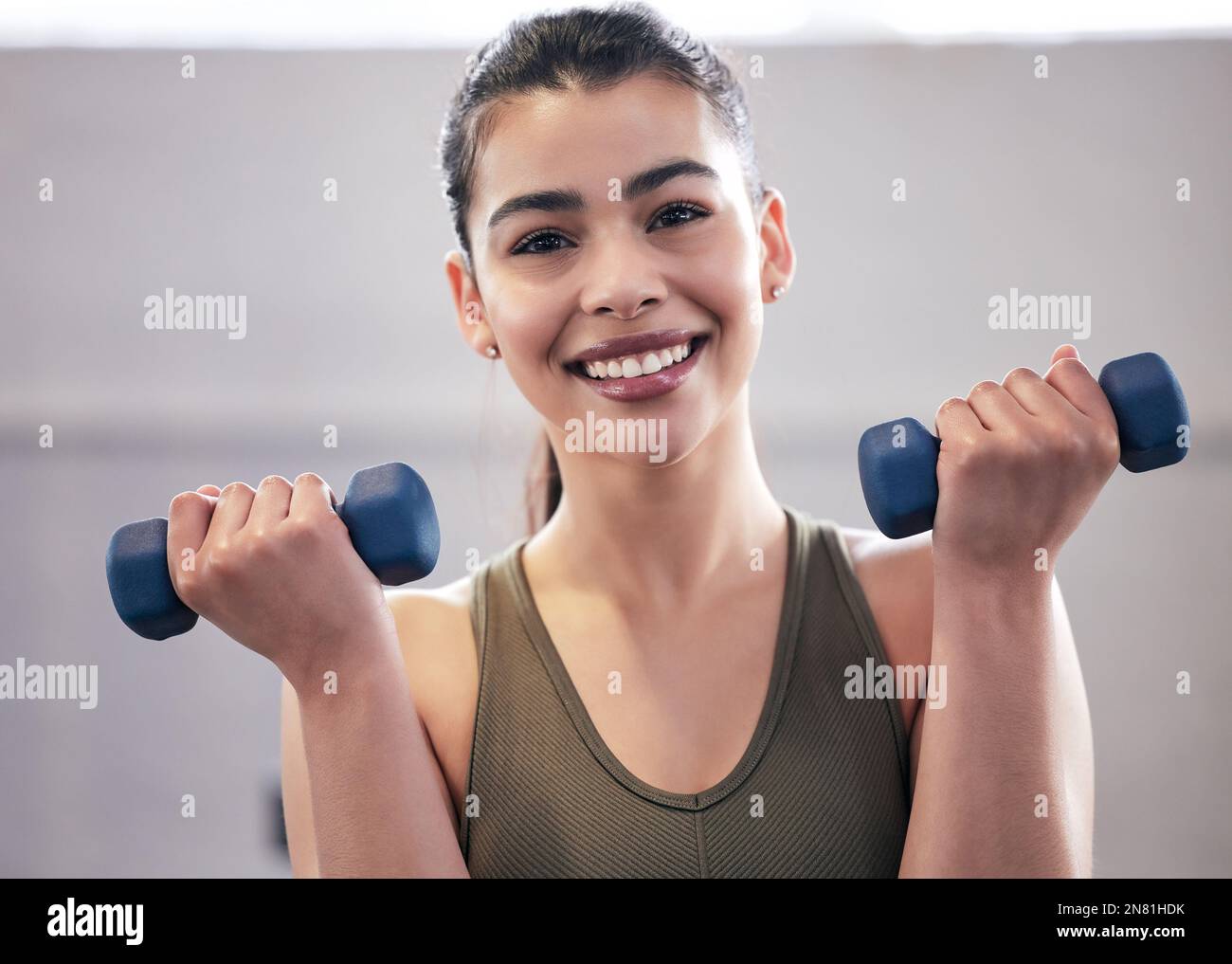 Weigh to go on reaching your fitness goals. Portrait of a young woman ...