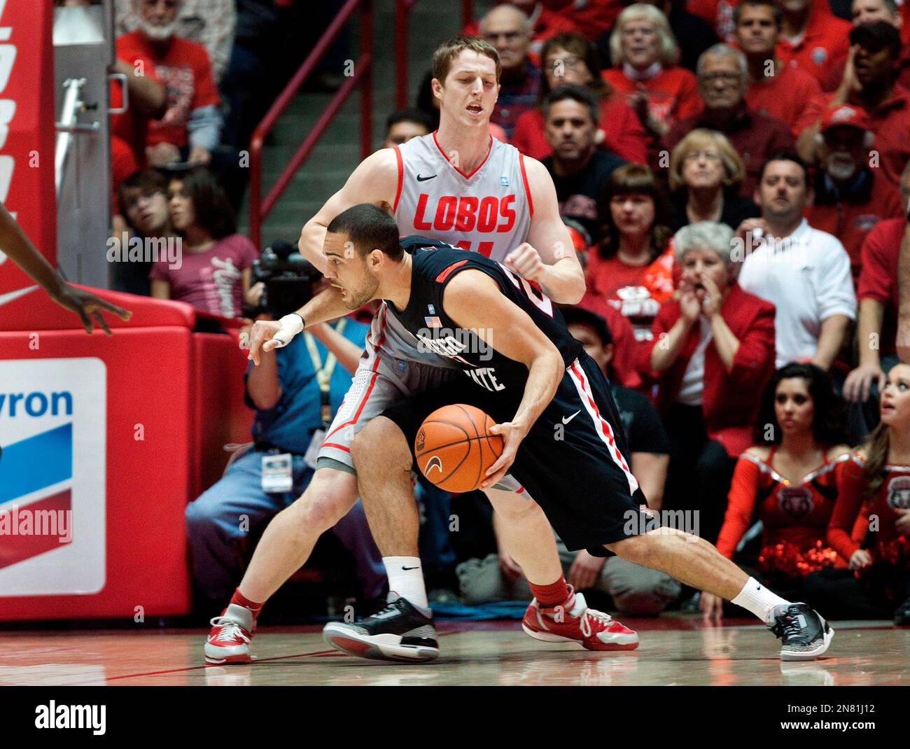 San Diego State's JJ O'Brien tries to dribble around New Mexico's ...