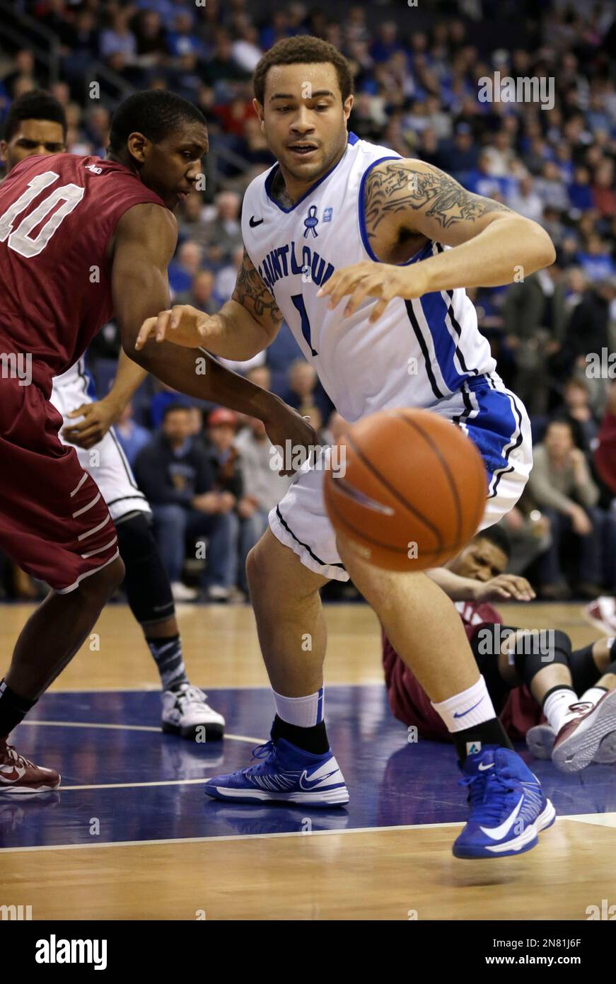 Saint Louis forward Grandy Glaze, right, and Saint Joseph's guard ...