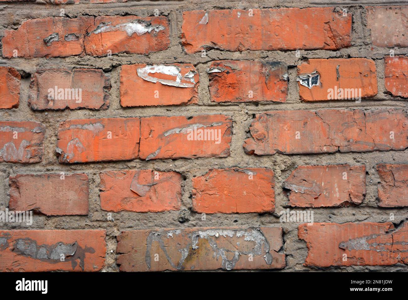 The building wall of one of the houses is built of old, solid red ...