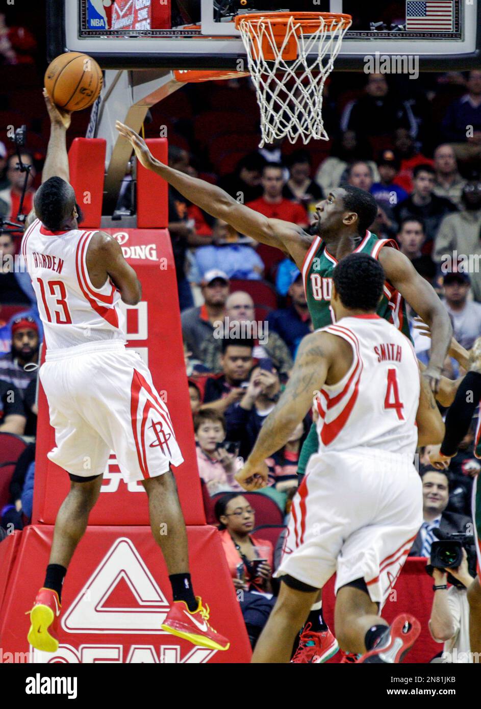 Houston Rockets guard James Harden (13) drives to the basket past ...