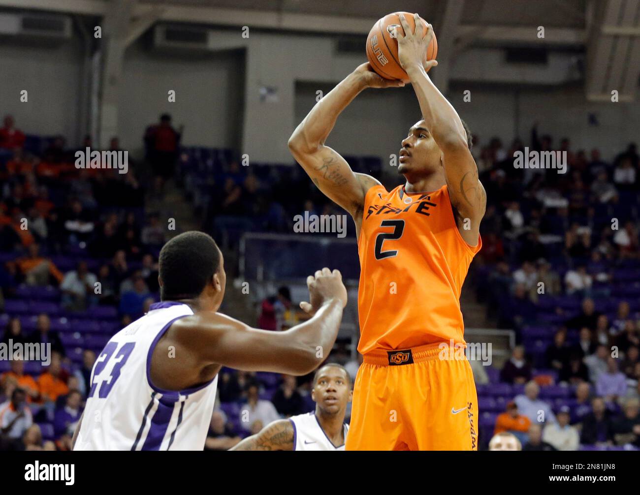 TCU 's Devonta Abron (23) defends as Oklahoma State's Le'Bryan Nash (2 ...