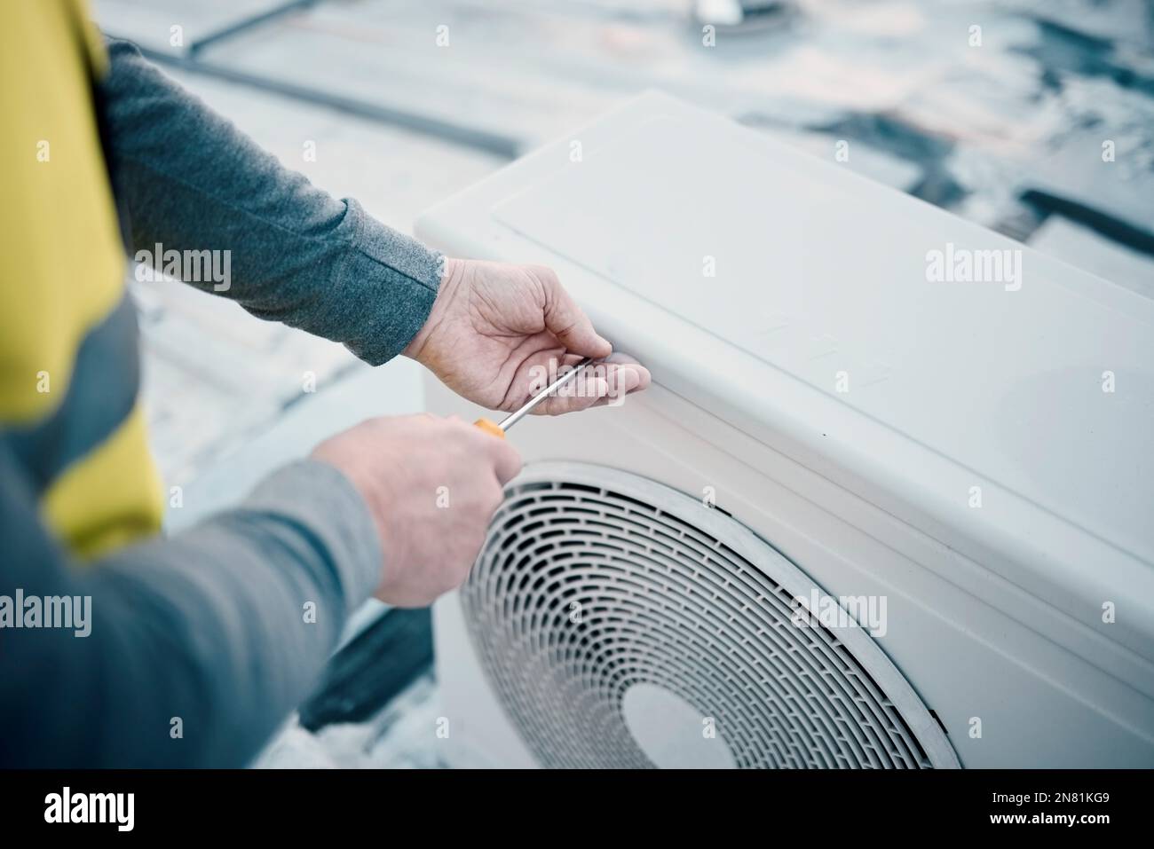 Hands, air conditioner and maintenance with a man construction worker ...