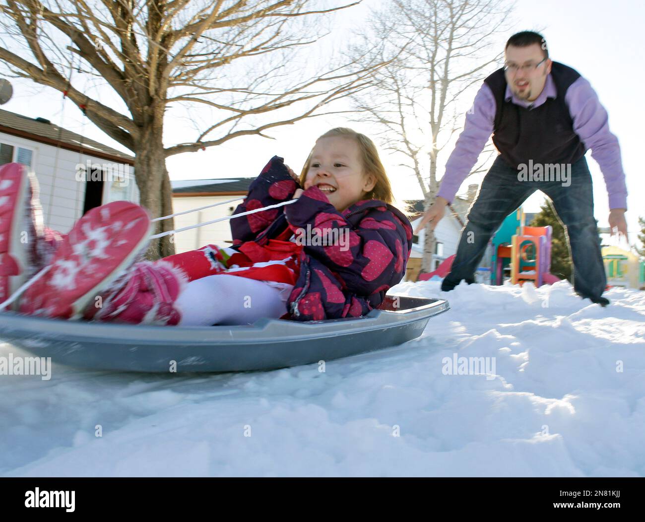 In this Monday, Feb. 25, 2013, photo, Coy Mathis is pushed on a sled by ...