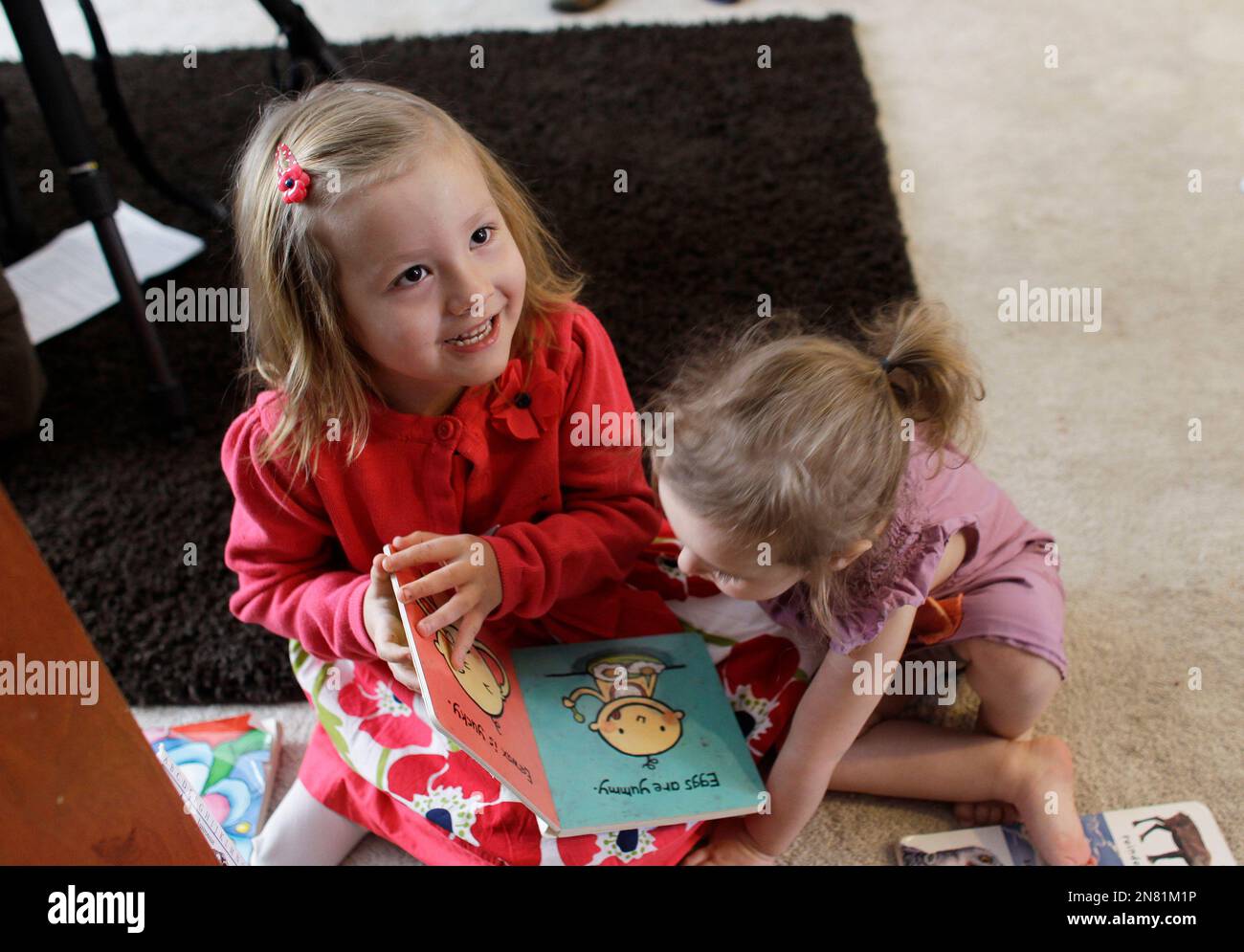 Coy Mathis, left, plays with her sister Auri, 2, at their home in ...