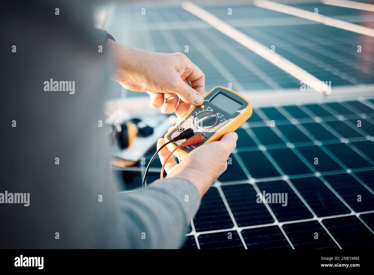 Solar panels, multimeter and engineering hands for voltage check ...