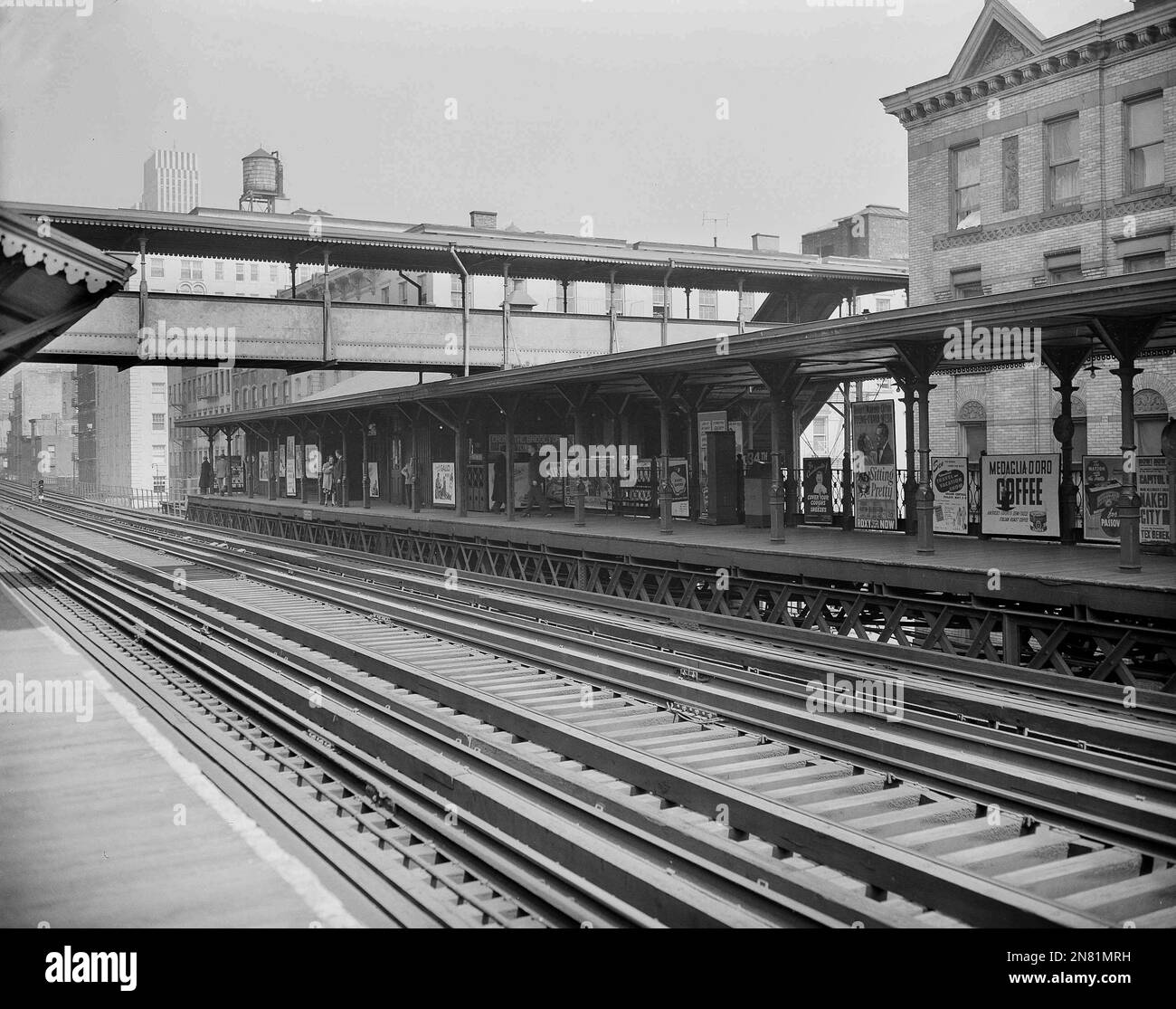 A view of the platform and tracks with cross bridge above, of the Third ...