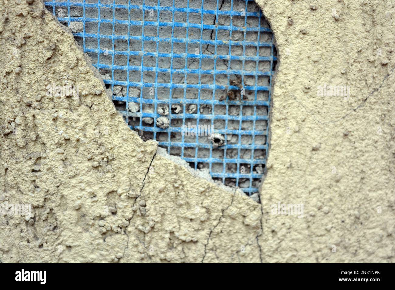 The building wall cladding is made of brown textured and structural ...