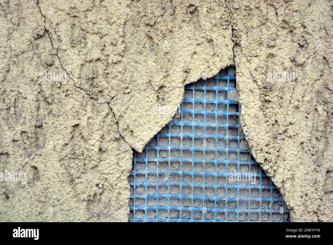 The building wall cladding is made of brown textured and structural ...