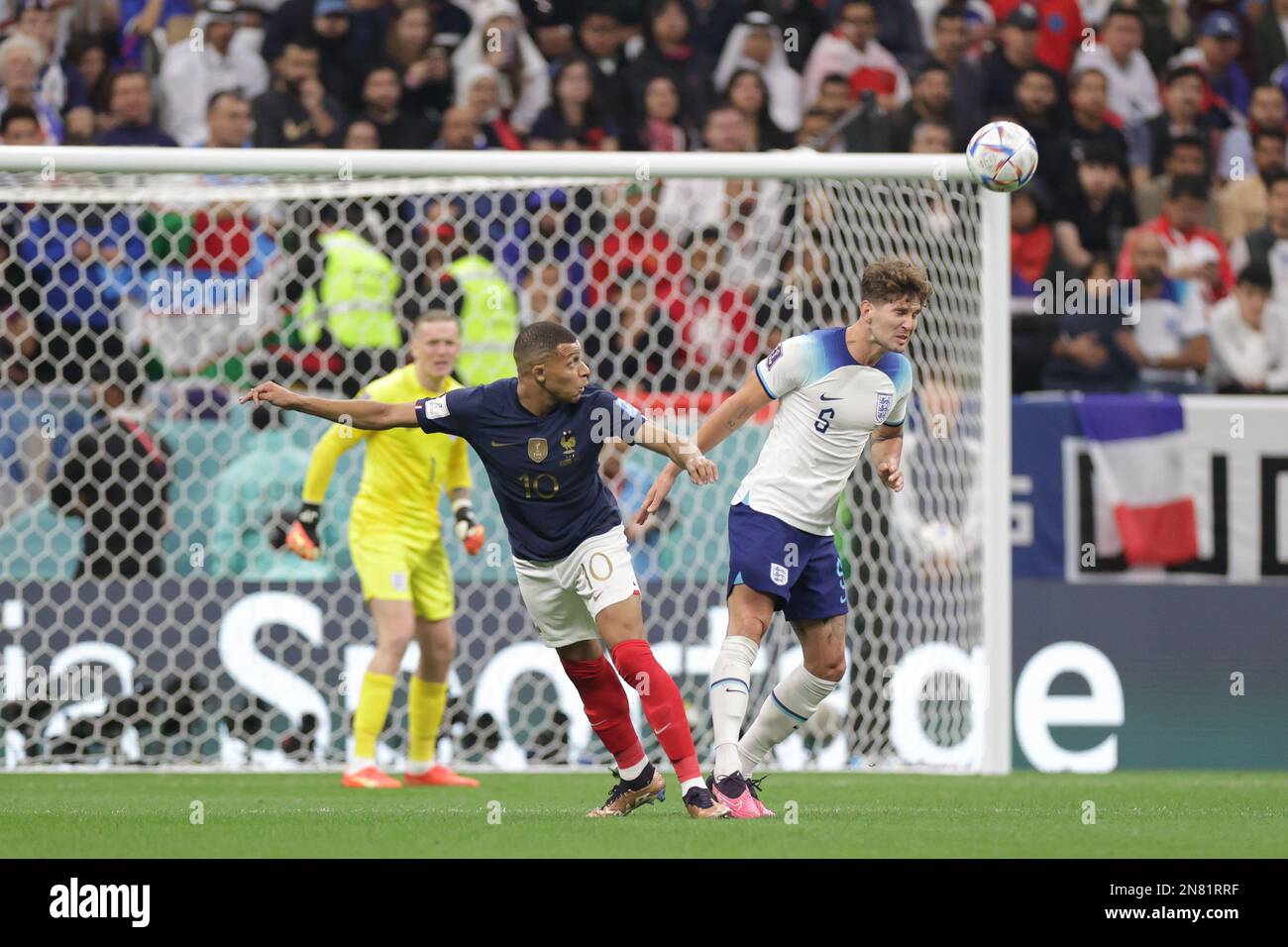 Kylian Mbappe of France (L) and John Stones of England (R) in action ...